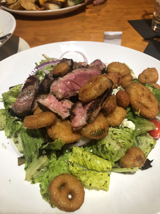 Steak salad that solves the eternal dilemma: "I should eat healthy, but I want steak." Those crispy onion rings aren't garnish&mdash;they're little halos of happiness. 