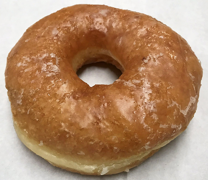 The humble glazed donut, elevated to art form—a glistening testament to the fact that classics never go out of style.