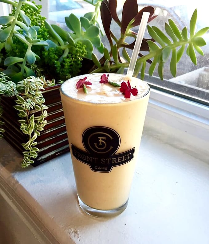 A smoothie garnished with flowers because sometimes Monday mornings require both caffeine and beauty. Front Street's golden elixir promises to banish the blues. 
