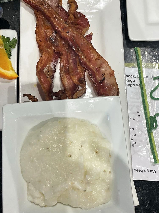 Creamy grits meet crispy bacon in a Southern comfort food marriage made in breakfast heaven.