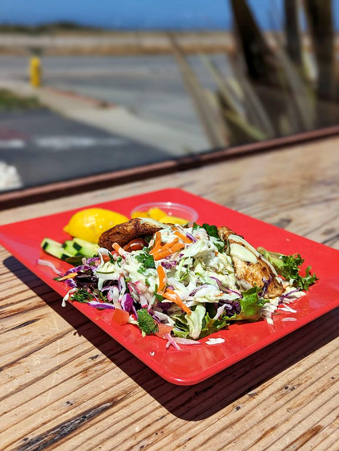 A fish taco that deserves its own red carpet. Fresh, vibrant, and piled so high with slaw it requires strategic eating techniques.