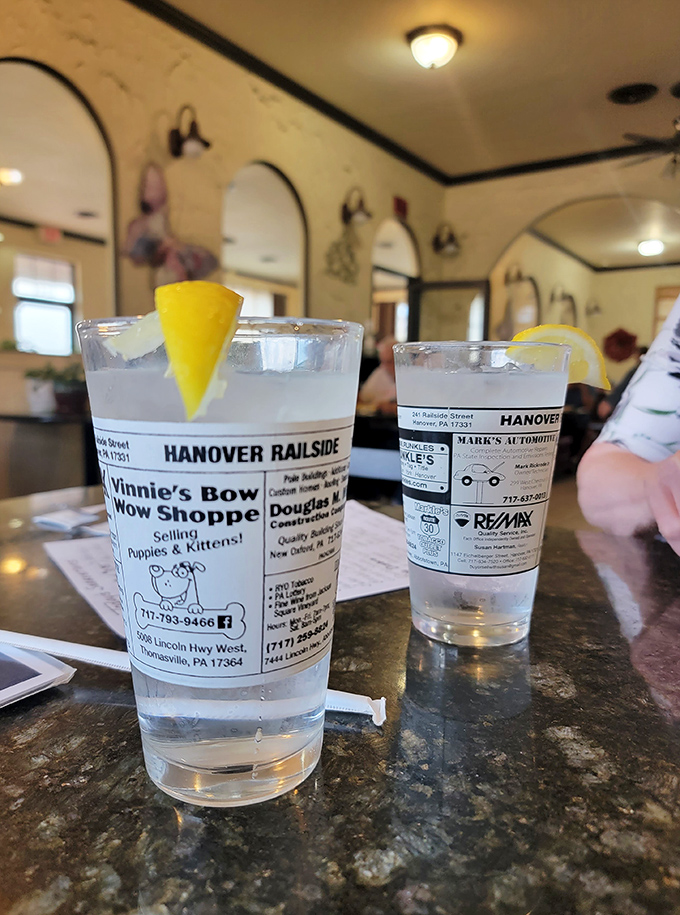 Even the water glasses tell stories here—adorned with local business ads that connect you to the community while you hydrate.