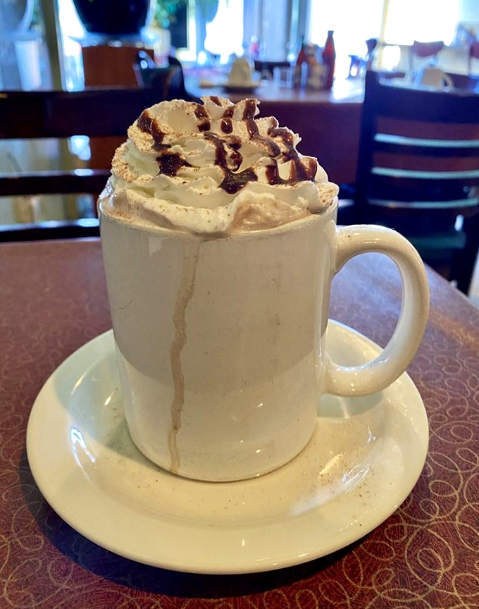 This isn't just hot chocolate &ndash; it's a warm hug in a mug, topped with a cloud of whipped cream that's begging to give you a mustache.