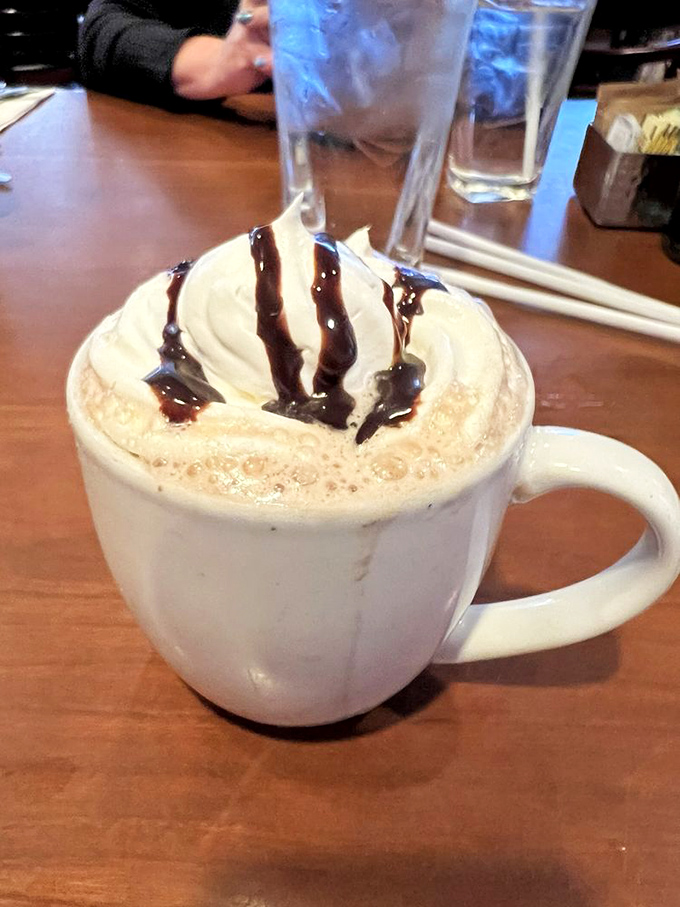 Hot chocolate that doesn't just warm your hands but sends your taste buds to therapy&mdash;whipped cream melting into chocolate bliss.