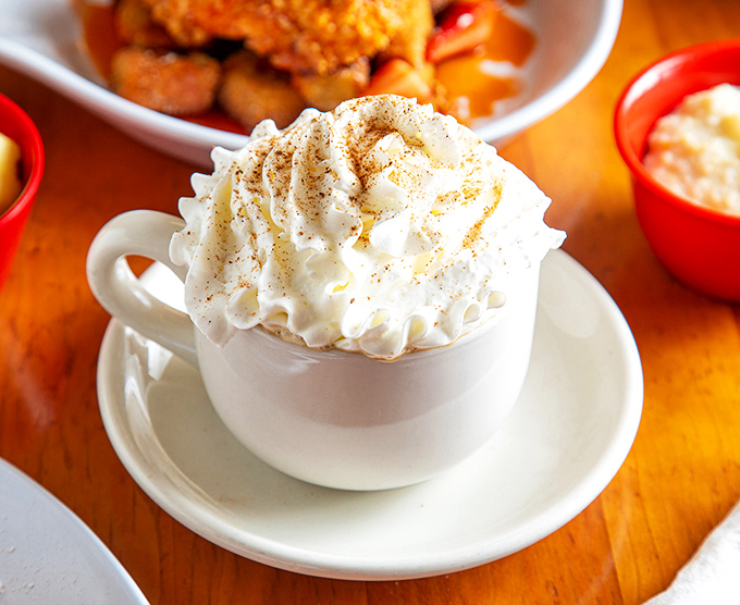 This isn't just hot chocolate&mdash;it's liquid comfort wearing a whipped cream hat, ready to solve all your problems one sip at a time.