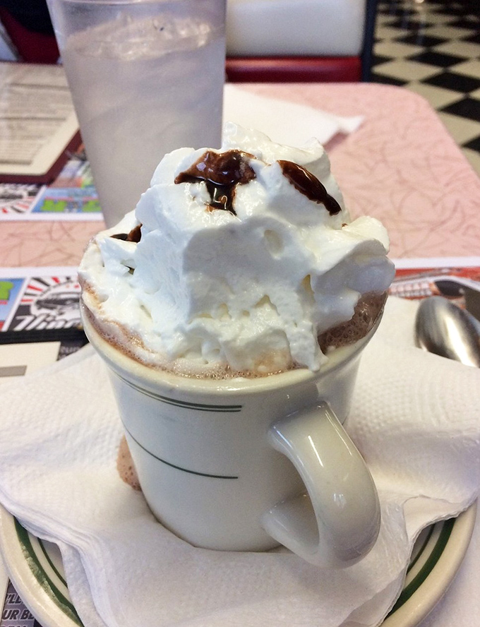 Hot chocolate that understands its purpose in life isn't just to warm you up, but to create a mountain of whipped cream real estate.