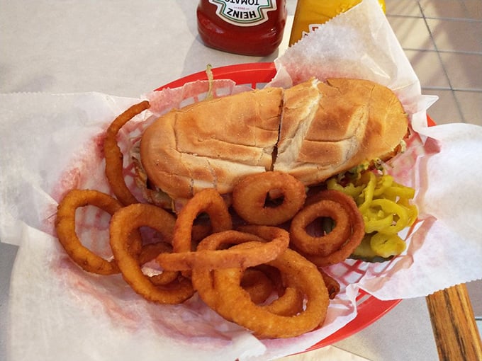 The onion ring crown jewels surrounding a sandwich fit for royalty. This basket of goodness is why diets always start "tomorrow."