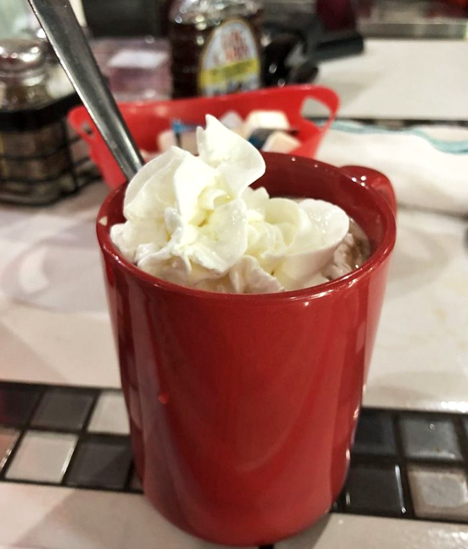 Hot chocolate served with such genuine enthusiasm it makes you wonder if Swiss Miss has been lying to you all these years.