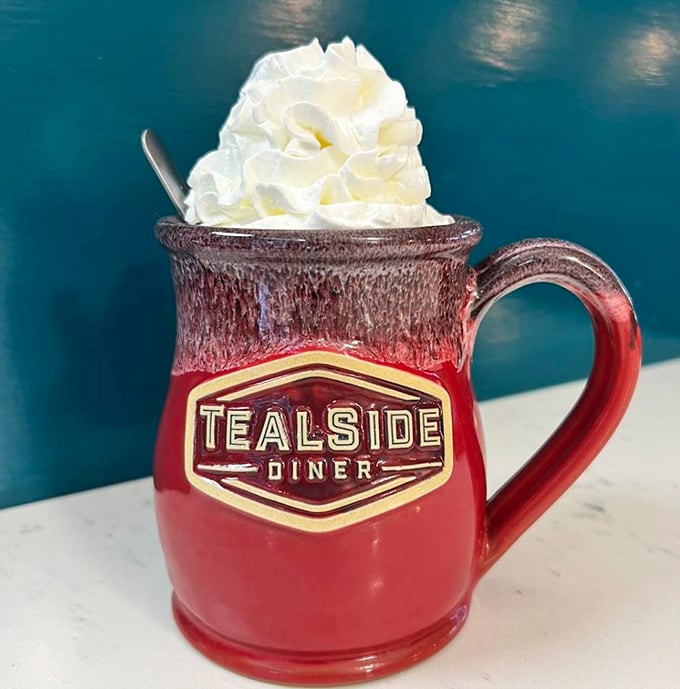 That's not just hot chocolate, that's a mug of liquid happiness topped with a cloud of whipped cream in Tealside's signature pottery.