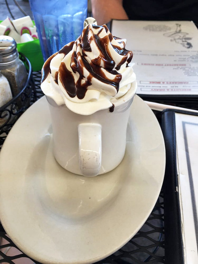 Not just hot chocolate&mdash;it's a towering cloud of whipped cream drizzled with chocolate that makes you question why we ever grew up