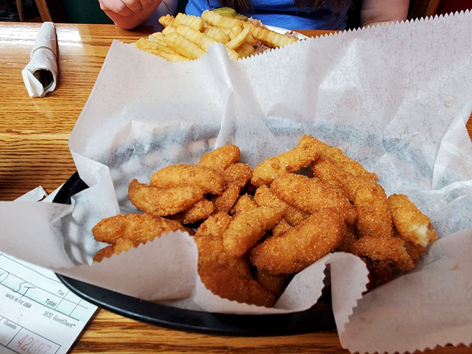 Hush puppies golden and crisp, waiting to be dunked. These cornmeal treasures are the unsung heroes of any barbecue feast.