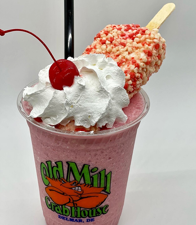 A strawberry shake topped with whipped cream and a popsicle&mdash;because sometimes dessert should look like it's dressed for its own party.