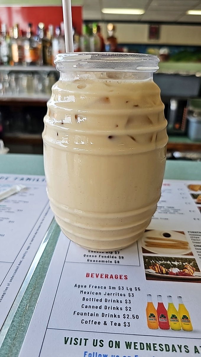 This isn't just iced coffee; it's a creamy, dreamy escape in a jar. The perfect companion while contemplating your next menu conquest.