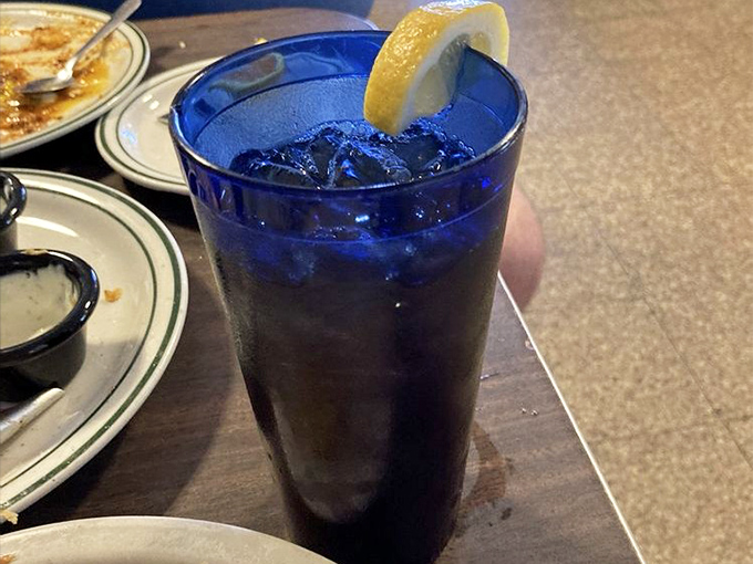 That cobalt blue glass isn't just serving iced tea&mdash;it's serving Southern hospitality in liquid form. The lemon wedge is just showing off.