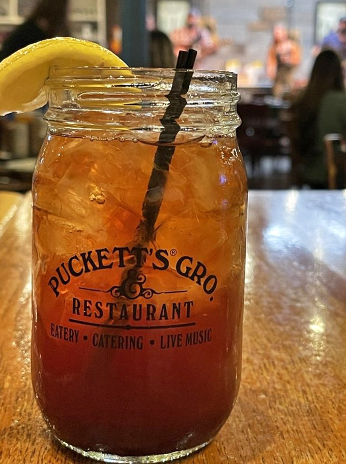 Sweet tea served in a mason jar &ndash; because in Tennessee, proper hydration comes with Southern credentials and a lemon slice.