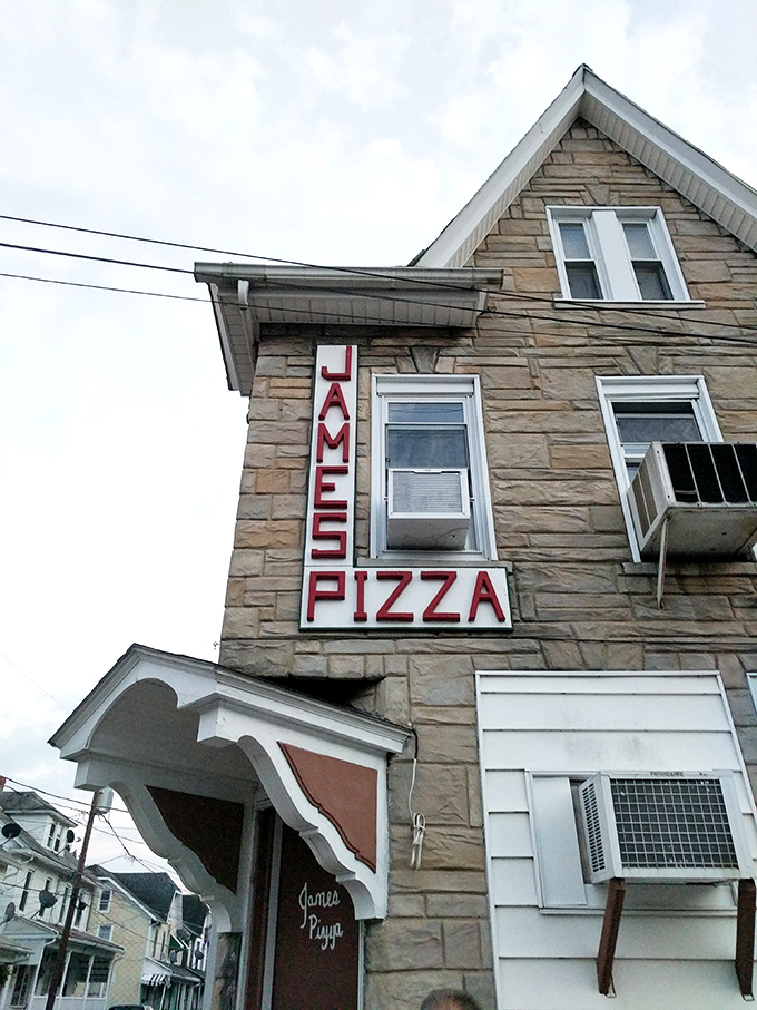 James' Pizza sign promises what generations of locals already know &ndash; some traditions are too delicious to change. Stone buildings and comfort food endure.