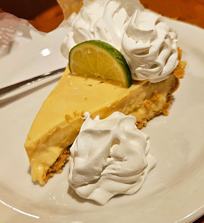 Key lime pie that strikes the perfect balance between tart and sweet &ndash; Florida's signature dessert presented with cloud-like whipped cream and a lime garnish.