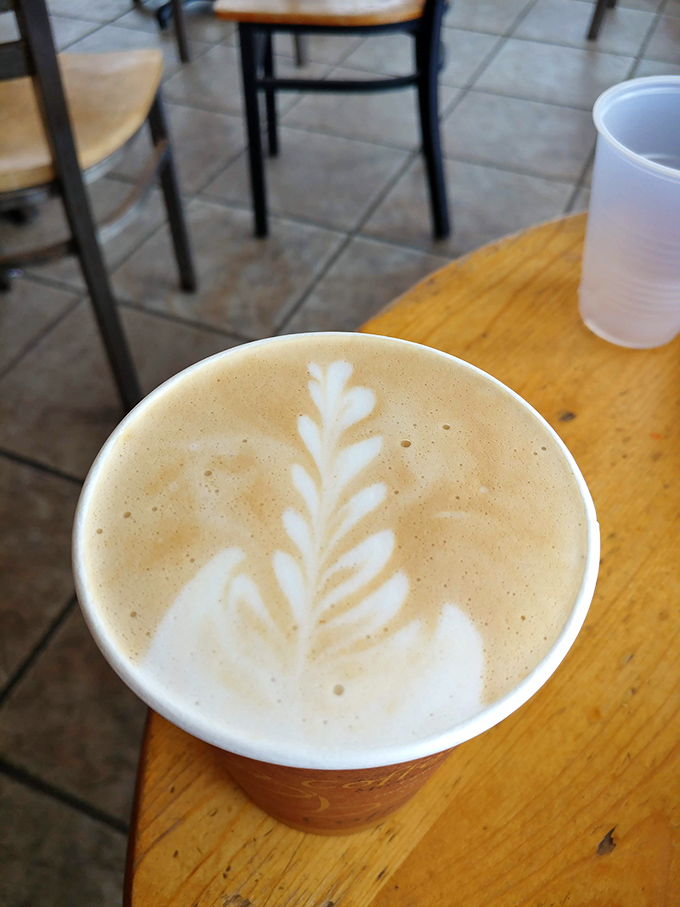 Latte art that doesn't need an Instagram filter&mdash;a simple leaf pattern that says, "We care about your coffee, but we're not going to lecture you about single-origin beans."