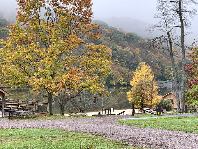 Misty mountain magic as fall paints the hillsides. Those cabins nestled by the shore whisper promises of cozy evenings by crackling fires.