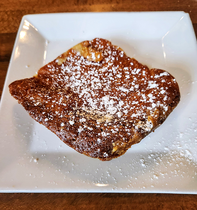 This lemon butter cake isn't just dessert; it's therapy on a plate, dusted with powdered sugar like the first perfect snowfall of winter.