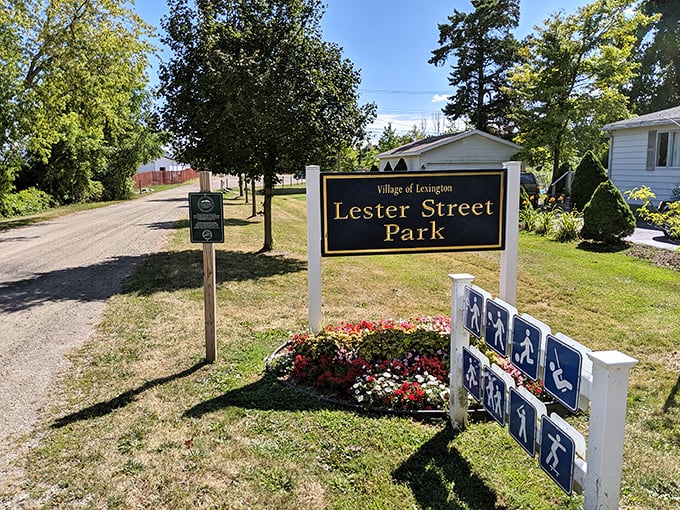 Lester Street Park welcomes visitors with classic small-town hospitality, where carefully tended flower beds frame the entrance to community green space.
