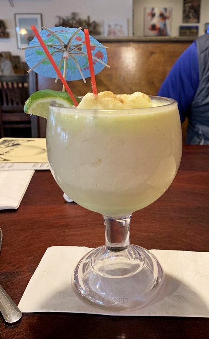 A vacation in a glass! This creamy lime pi&ntilde;a colada comes with its own tiny umbrella, because even your drink deserves some shade in Florida.