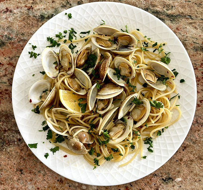 Linguine with clams so fresh they practically introduce themselves. Simple ingredients letting the ocean's bounty shine in every twirl.