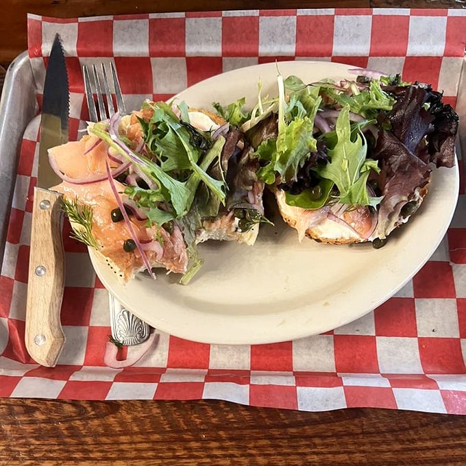 Ocean meets garden in this gorgeous open-faced salmon creation. Fresh greens and delicate fish prove that not all deli magic requires melted cheese.