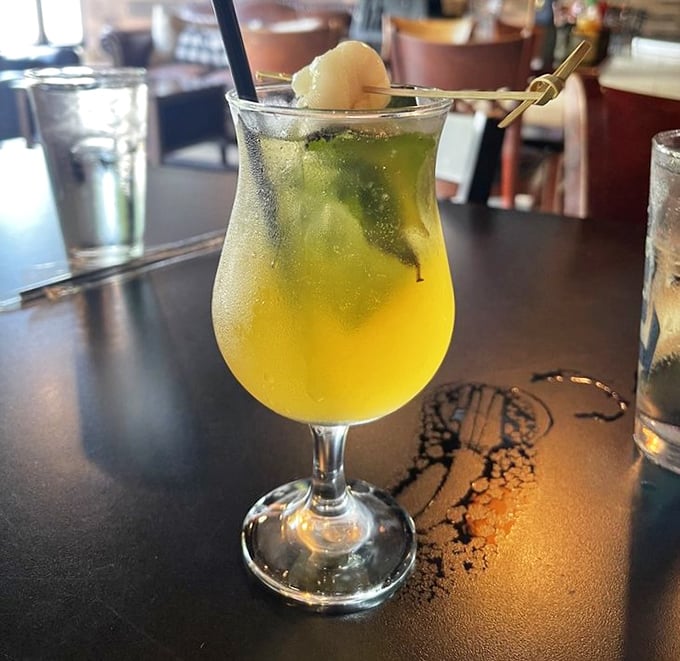 This sunshine-yellow cocktail isn't just a drink&mdash;it's a vacation in a glass. The lychee garnish winks at you like it knows something you don't.