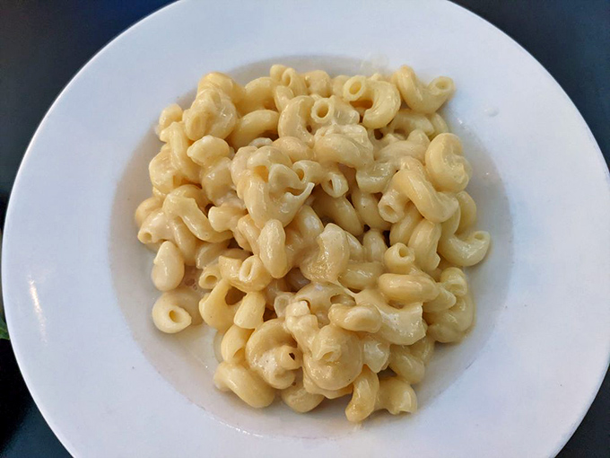 Mac and cheese so perfectly simple it makes you question why anyone would complicate this classic. Childhood nostalgia on a grown-up plate.