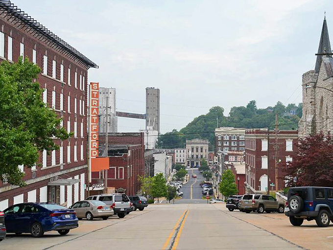 Main Street slopes dramatically toward the Mississippi, creating a cinematic backdrop for everyday errands and affordable weekend strolls.