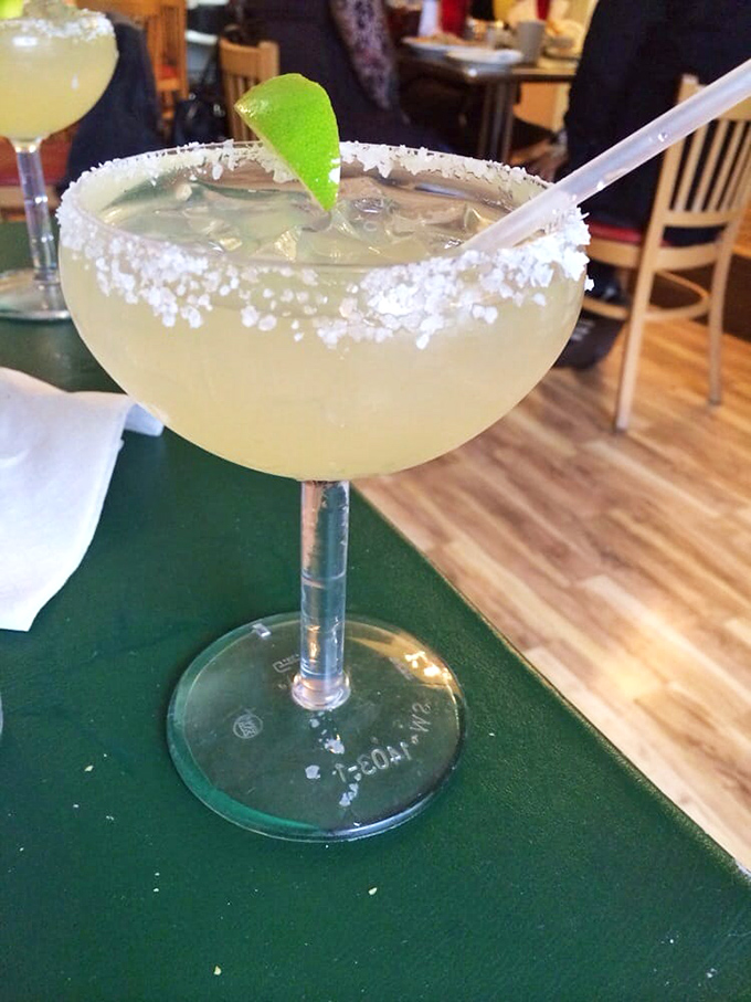 This isn't just a margarita—it's vacation in a glass, with salt-rimmed edges promising the perfect balance of tart, sweet, and "why not?"