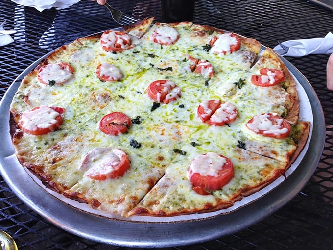 Simple perfection on a pizza pan—fresh tomatoes, melted cheese, and herbs create the kind of margherita that makes you wonder why anyone bothers with complicated toppings.