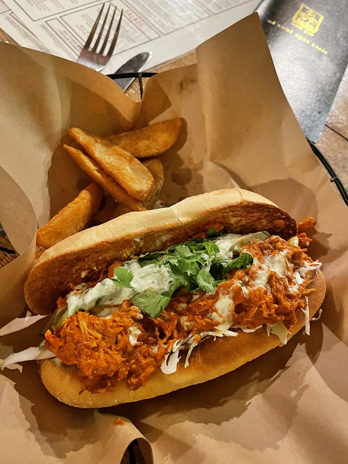 A sandwich that demands both hands and your full attention &ndash; tender meat, vibrant sauce, and fresh toppings on a roll that's up to the task.