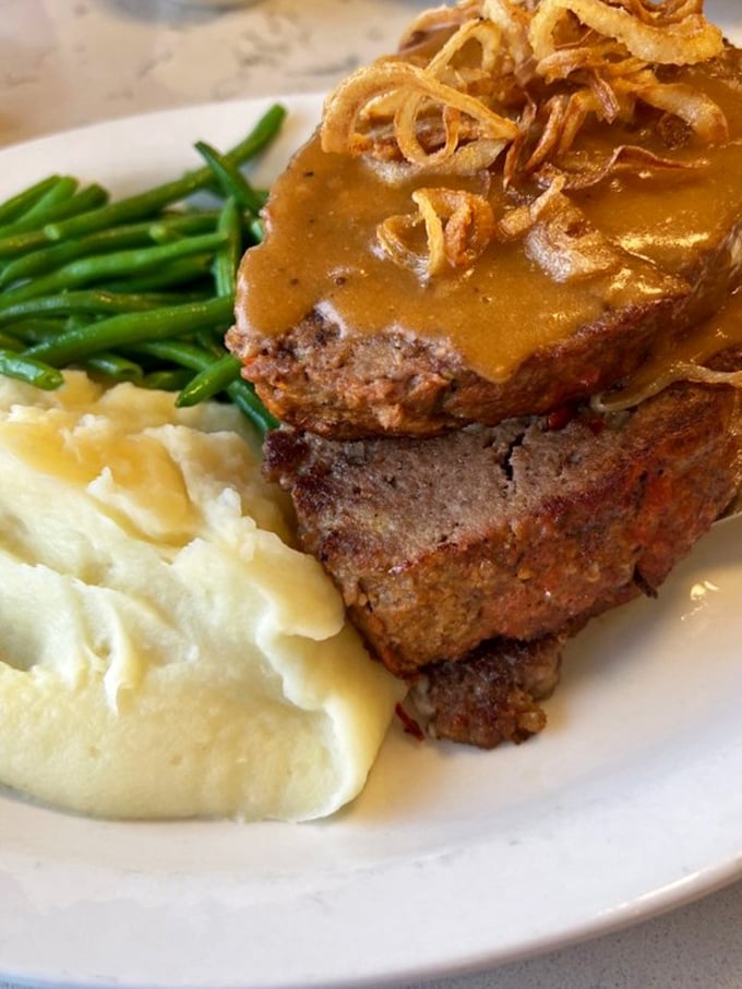 Meatloaf that would make your grandmother both jealous and proud, crowned with gravy and served with sides that know their supporting role.