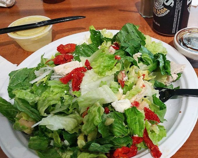 Fresh greens, vibrant tomatoes, and feta cheese converge in a Mediterranean salad that makes eating healthy feel like cheating somehow.