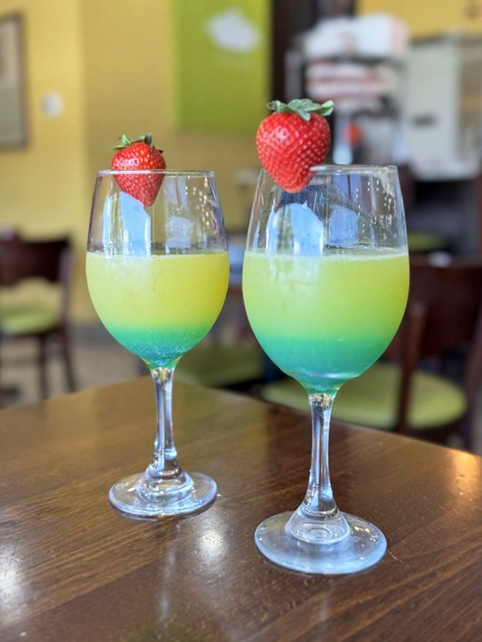 Mermaid Mimosas&mdash;where breakfast meets vacation vibes. These blue-yellow gradient beauties topped with strawberries are basically Florida in a glass.