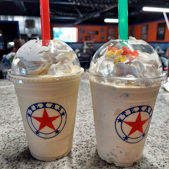 Texas-themed milkshakes topped with whipped cream mountains. These aren't just desserts, they're architectural achievements with straws.
