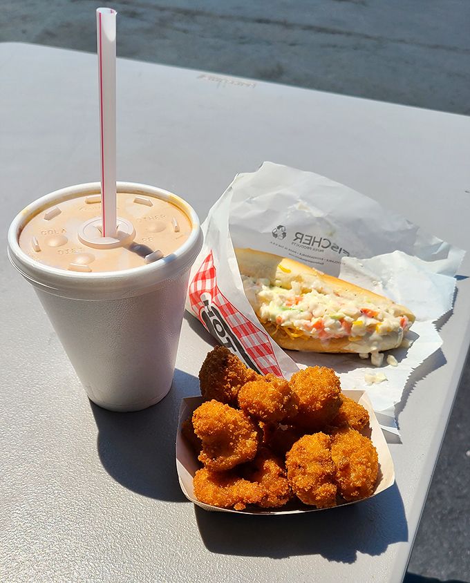 Drive-in dining perfection: crispy golden bites, creamy coleslaw, and a drink that doesn't need a fancy name to be spectacular.