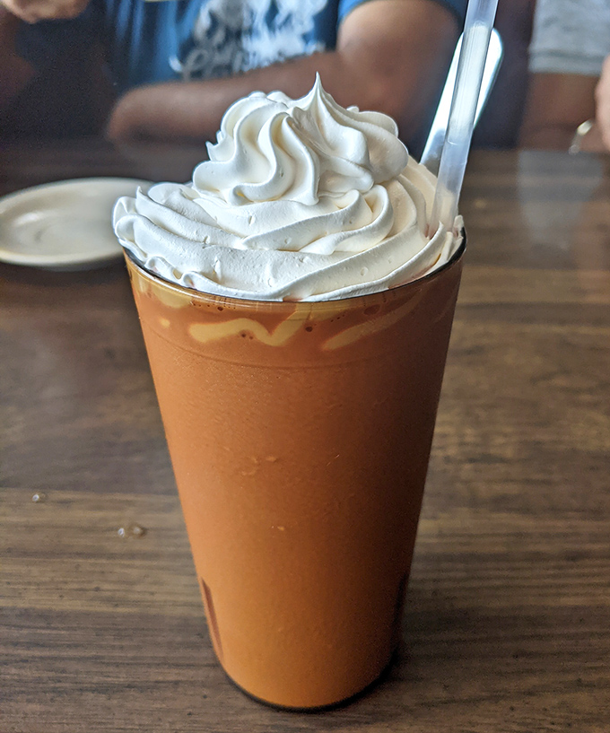 This mocha frappe towers like a caffeinated skyscraper, ready to jumpstart your afternoon with style.