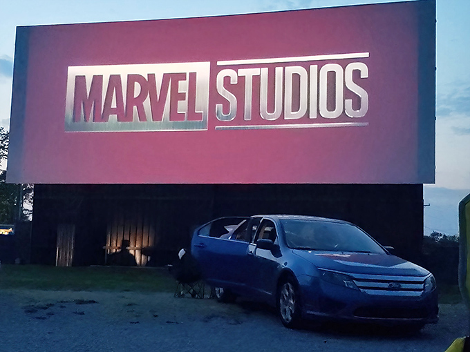 The massive screen stands sentinel against the sky, a monument to movie magic that's survived the streaming revolution.