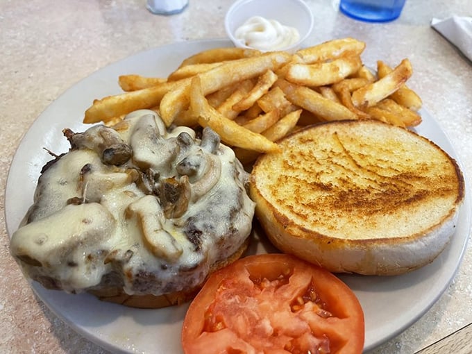 A burger that doesn't need fancy toppings to impress &ndash; just perfectly melted cheese, mushrooms, and a patty that means business.