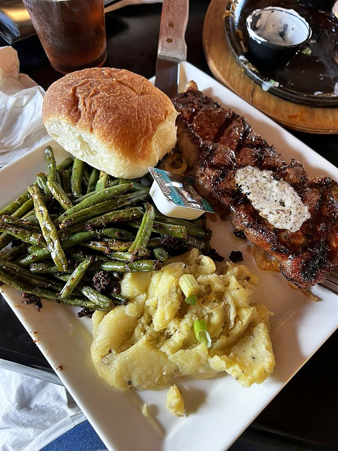 A steak that's been kissed by fire and topped with a pat of herb butter slowly melting into meaty perfection. Comfort food elevated.