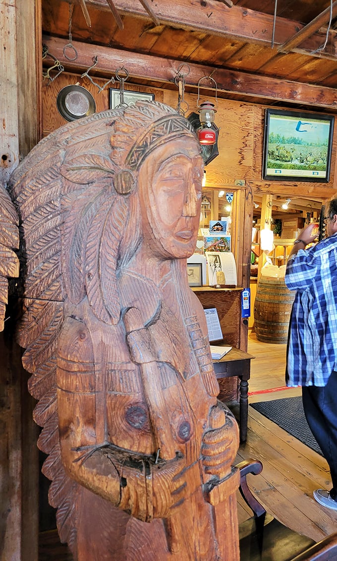 This magnificent wooden Native American carving stands as a respectful reminder of the original inhabitants who called this beautiful region home long before stores existed.