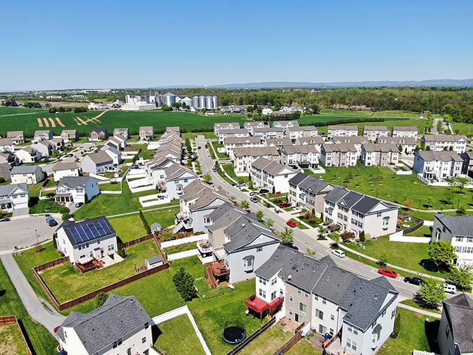 Modern residential developments stretch toward the horizon, with the Blue Ridge Mountains providing a stunning backdrop to Hagerstown's growing neighborhoods.