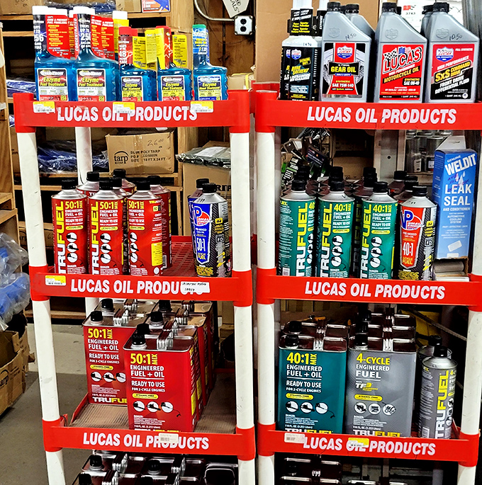 Automotive aficionados, rejoice! This meticulously organized display of oils and additives is the mechanical equivalent of a well-stocked medicine cabinet.