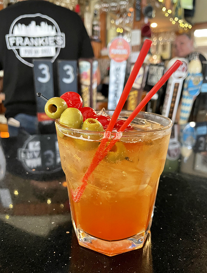 A proper Old Fashioned garnished with olives&mdash;because in Wisconsin, cocktails come with a side of tradition and enough garnish to count as a snack. 