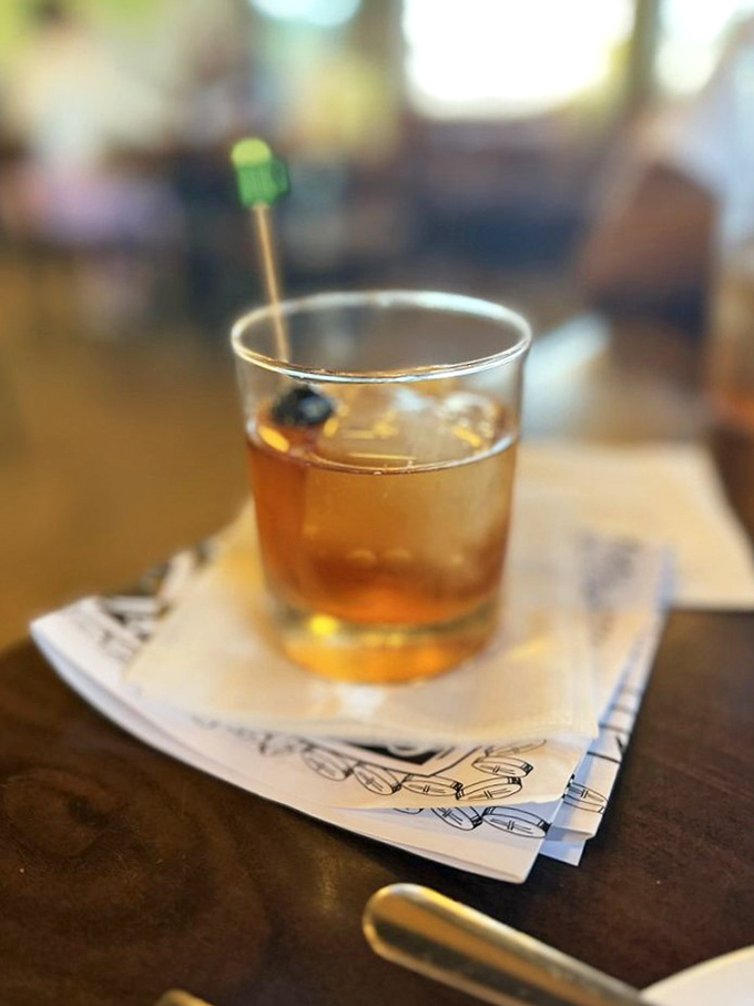 An old fashioned sits patiently on its napkin throne, ready to wash down whatever Texas-sized meal you've bravely committed to.