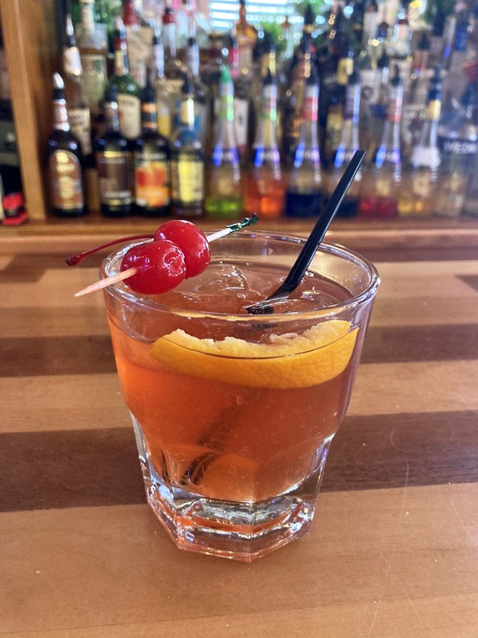 This isn't just a cocktail; it's an old fashioned with Florida sunshine in liquid form, complete with that cherry on top.
