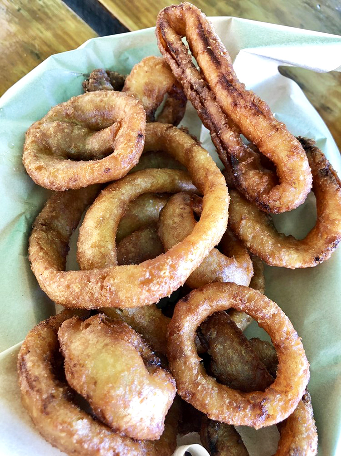 Onion rings with the structural integrity of Olympic medals and twice the satisfaction. Crispy, golden halos of deep-fried perfection.